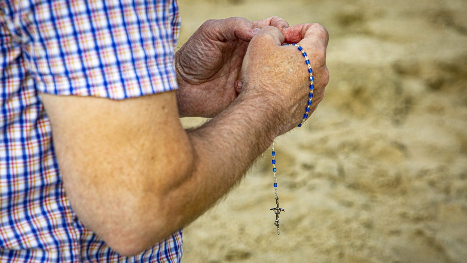 Rally participants gather near U.S. Capitol to pray rosary for the nation
