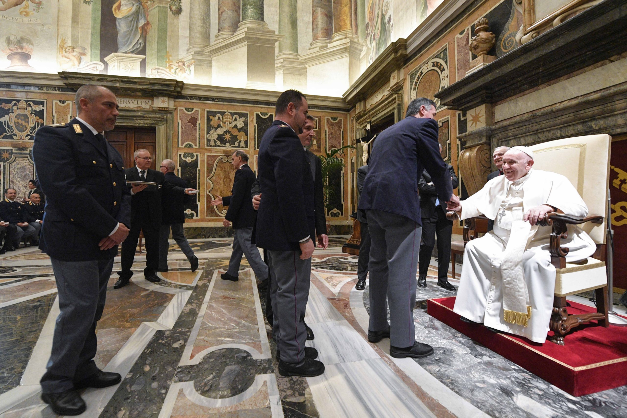 Read the Gospel, always show people God's love, pope tells police
